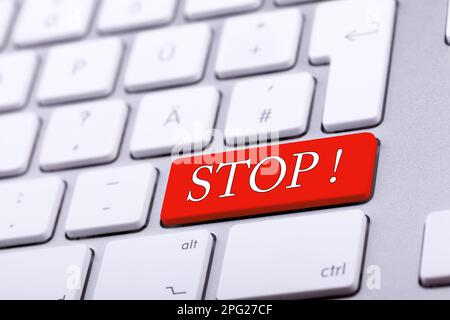 Aluminium keyboard with STOP word and sign in red. Studio photo ...