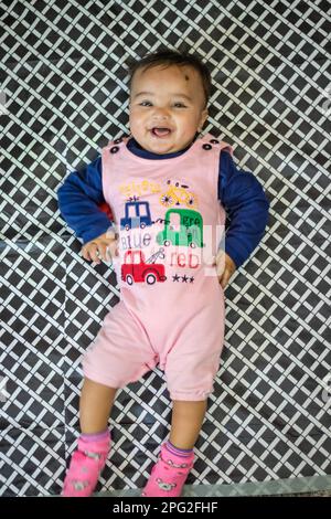 cute infant facial expressing from top angle indoor shot Stock Photo ...