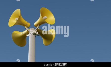 Yellow public address notification loudspeakers on a post against green ...