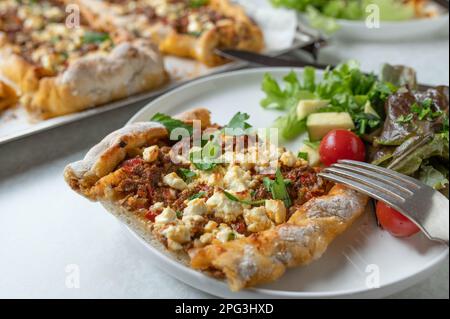 Turkish pide with mince meat, vegetable, feta cheese topping Stock ...