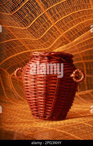ancient rods basken on orange background Stock Photo - Alamy