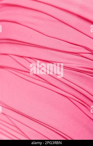 A soft, muted pink background with a subtle texture that adds depth and ...