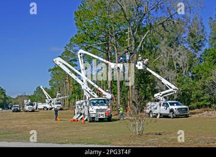 Multiple units of electric linemen at work in North Central Florida ...