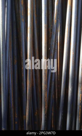 Round bar reinforced steel. heavy metal, iron texture background. black ...