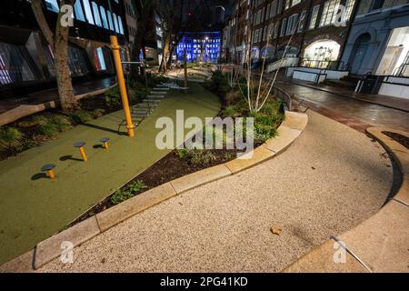 Flower borders, seating and play facilities fill Alfred Place in ...