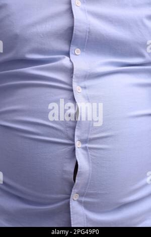Fat obese male wearing a tight t shirt Stock Photo - Alamy