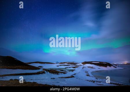 The northern lights (Aurora Borealis) over Indre Karvik, Tromso by a ...