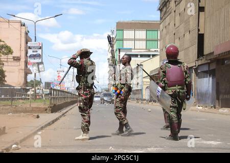 Nairobi, Kenya. 20th Mar, 2023. A plain cloth police officer fires a ...