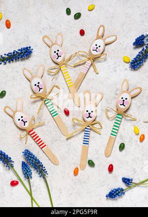 Funny handmade Easter rabbits on wooden table Stock Photo - Alamy