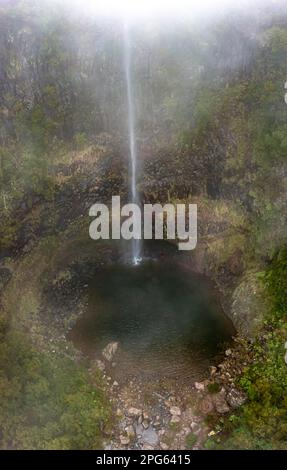 Aerial view, Lagoa do Vento with Upper Risco waterfall, forest and fog ...