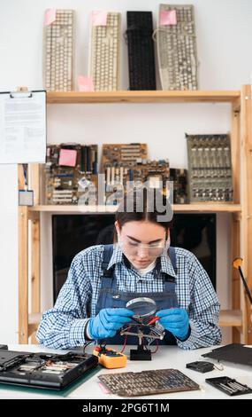 female engineer repairs laptop support fixing notebook computer Stock ...