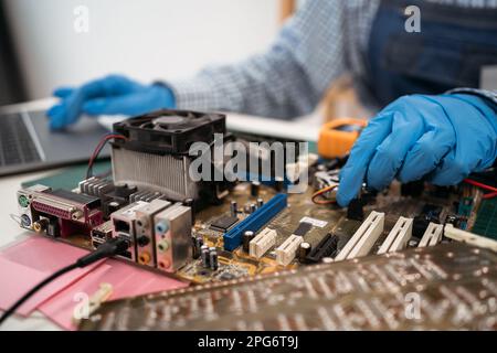 Technician replacing electronic control board inside disassembled ...