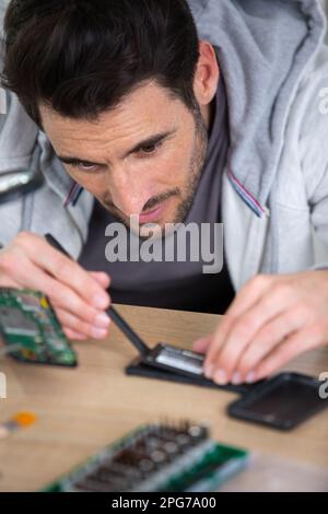 man during repair of wi-fi router Stock Photo - Alamy