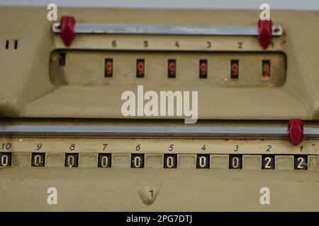 An antique mechanical calculator for counting funds Stock Photo - Alamy