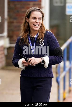 Headteacher Flora Cooper, wearing a black armband, welcomes children to ...