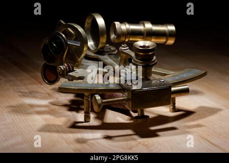 old sextant, spyglass, circle and compass lying on wooden table Stock ...