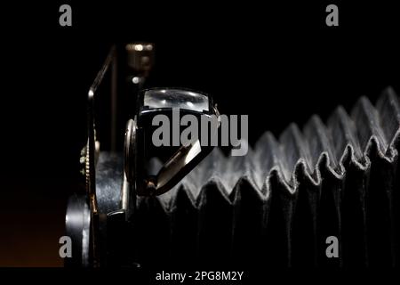 details of a vintage analog bellows camera with black background Stock ...
