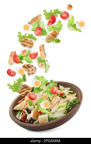 Plate of tasty Caesar salad and ingredients on color background Stock ...