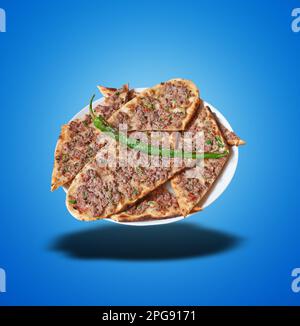 Floating Turkish Pide on Plate on blue gradient background Stock Photo ...