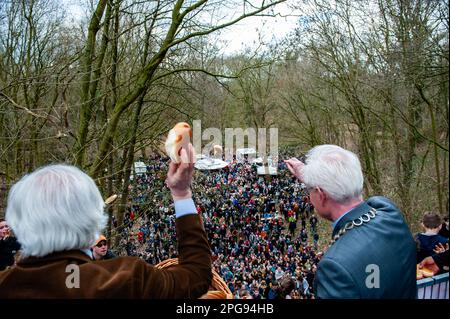 The Mayor of Sittard (R) and one of the aldermen are seen throwing buns ...