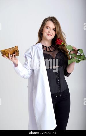 young bride in medical mask looking at camera isolated on grey, banner ...