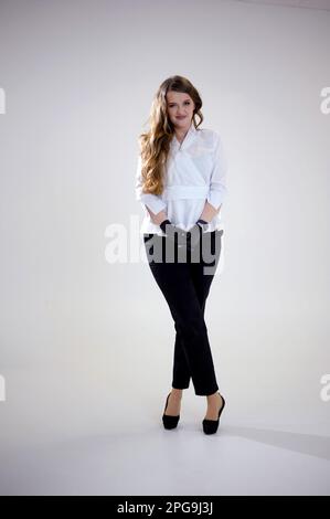 Professional pedicure. Pedicure master wearing latex gloves cuts female ...