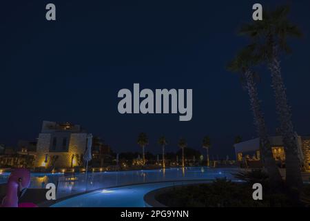 Beautiful night scenery overlooking hotel grounds. Lighting, trees ...