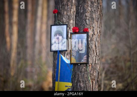Flowers on the ground at a makeshift memorial near Wang Fuk Court ...