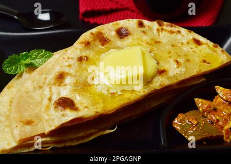 Butter paratha with achar in plate, healthy indian breakfast Stock ...