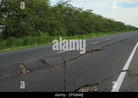 Large cracks on asphalt road after earthquake Stock Photo - Alamy