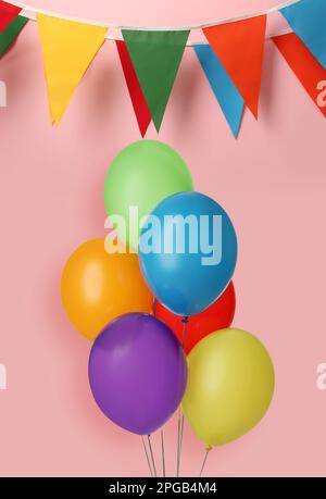 A different colorful flags on the wall Stock Photo - Alamy