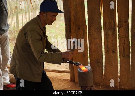 Blacksmith, Hmong village, Hmong, Hmong people, near Phonsavan, Xieng ...