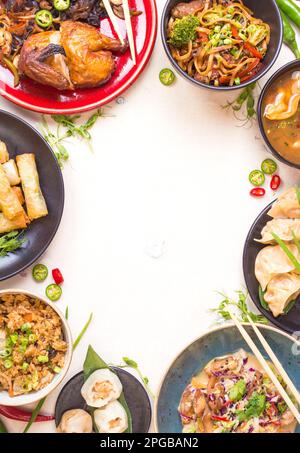 Spring rolls, noodles small bowl of curry and white rice on the ...