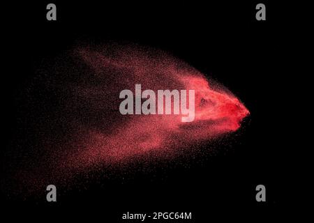 Red dust particles explosioon on black background.Red powder splash ...