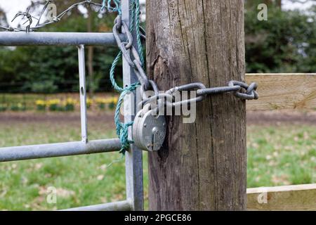 Locks, gates and barbed wire Stock Photo - Alamy