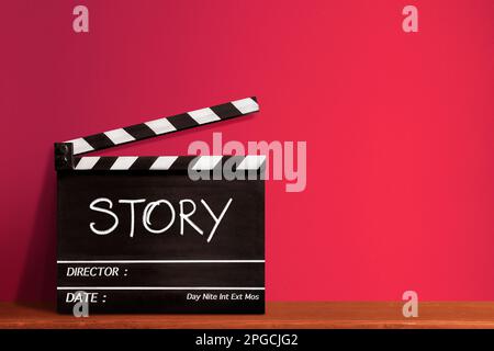 Your Story, handwritten text title on film slate for film industry, red ...