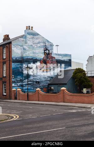 A stunning mural of a lifeboat at sea on the wall of the Ship Inn pub ...