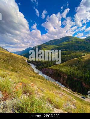 The narrow river Chuya in the canyons among the mountains flows with a ...