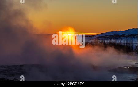 Iceland's great Strokkur geyser just before erupting with mist and ...
