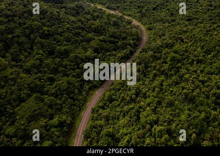 Aerial photo of a stretch of the Hummingbird Highway, surrounded by ...