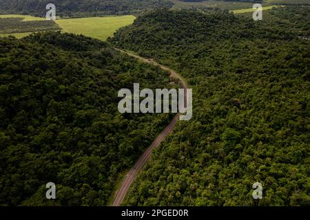 Aerial photo of a stretch of the Hummingbird Highway, surrounded by ...