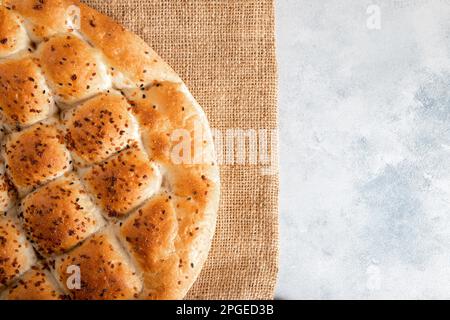 Traditional Ramadan pita on burlap sack.Holy bread for Muslims Stock ...