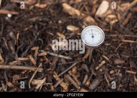 Immature compost managed in a community composter placed in a common ...