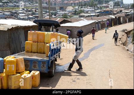 KENYA, Nairobi, Kibera slum, water hose and sewage / KENIA, Nairobi ...