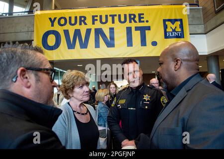 Genesee County Sheriff Christopher Swanson, center left, welcomes ...