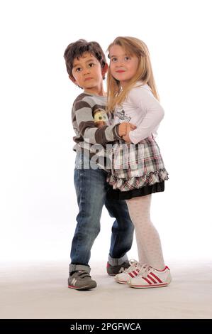 cute little lovers are dancing couple hugging and kissing on a white ...