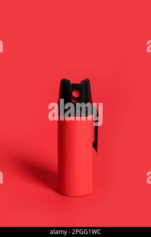 Bottle of pepper spray and red hot chilli on white background Stock ...