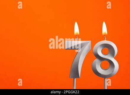 Candle number 78 - Birthday in blues foamy background Stock Photo - Alamy