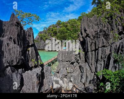 A bay with majestic rocks in Coron, Palawan in the Philippines that are ...