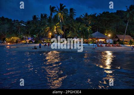 Sandy beach of El Nideo, Palawan in the Philippines, with hills in the ...